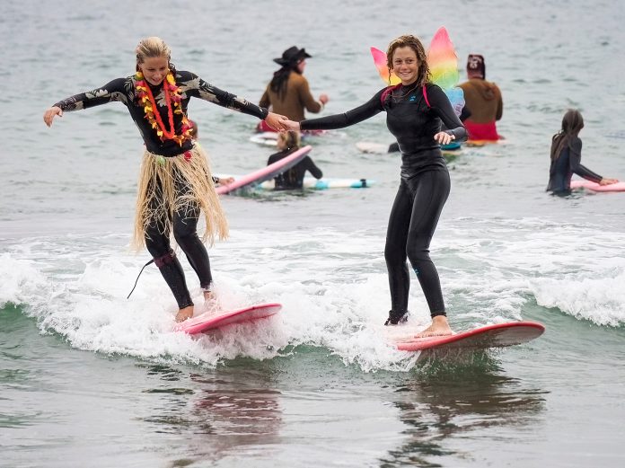 Costumed Surfers Hit the Waves for Annual Blackies Halloween Surf Event ...